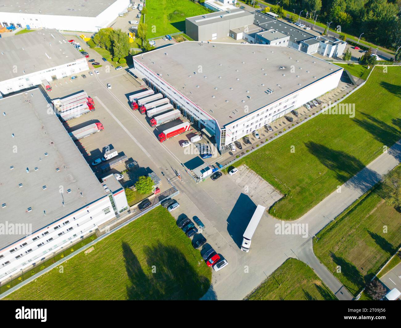 Logistics park with warehouse. Semi-trailers trucks standing on car ...