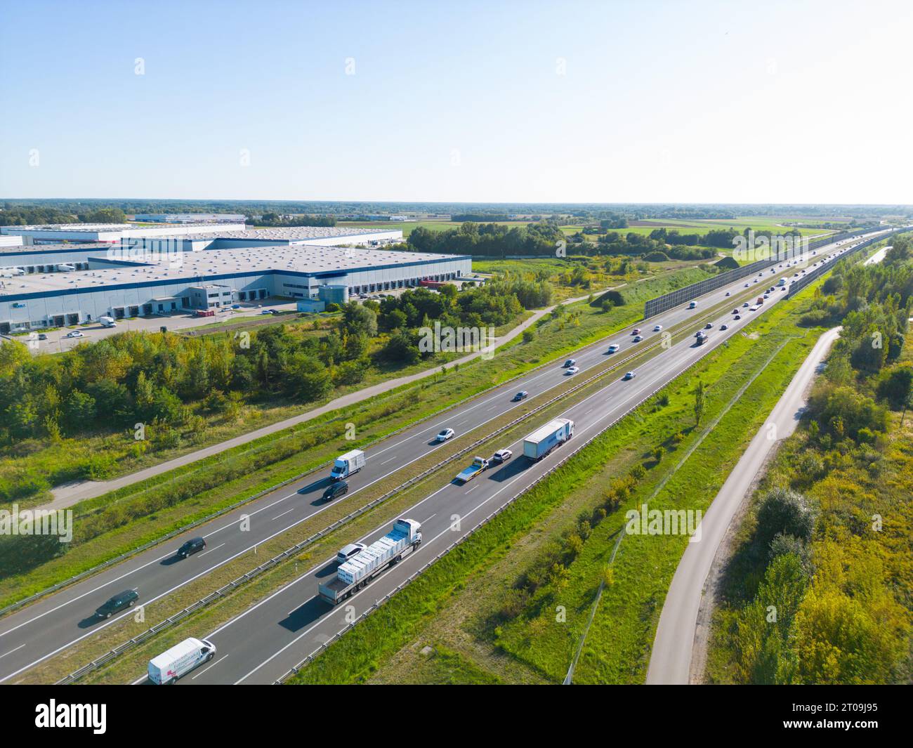 Logistics park with warehouse. Semi-trailers trucks standing on car ...
