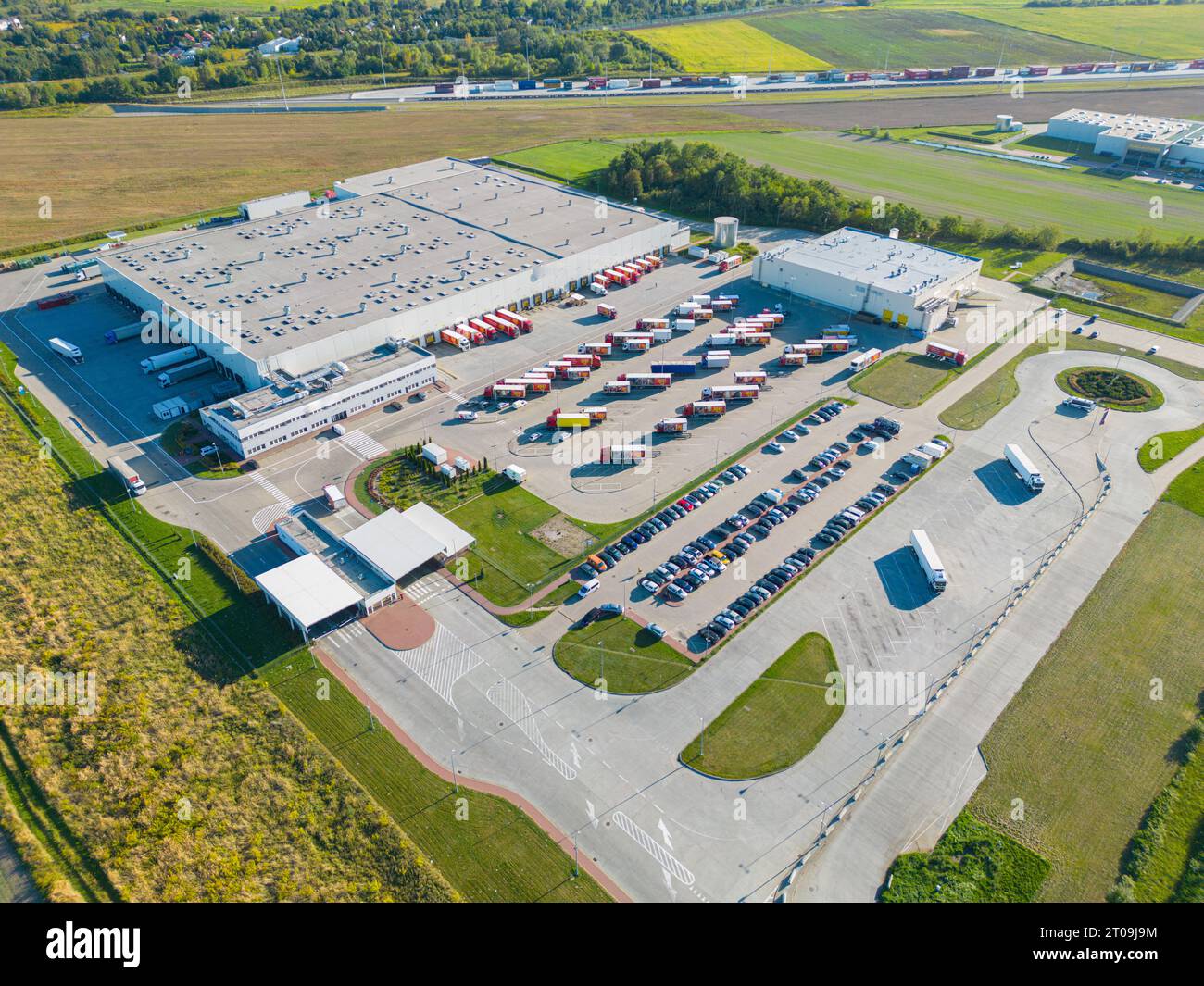 Aerial view of the logistics park with warehouse, loading hub and many ...
