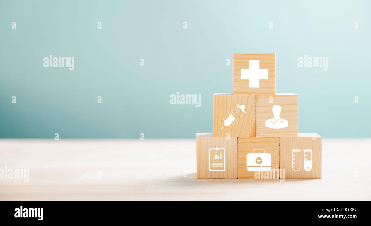 Medical symbols on wooden blocks stacked Stock Photo - Alamy