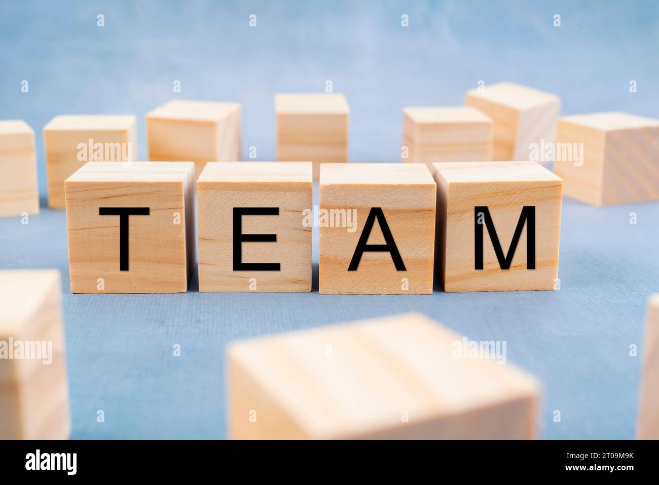 TEAM written on wooden cubes surrounded by a lot of blank cubes on old ...