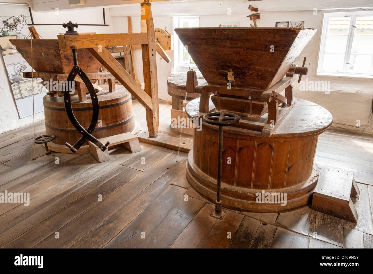 Grinding room of a historic water mill with two grinding funnels ...