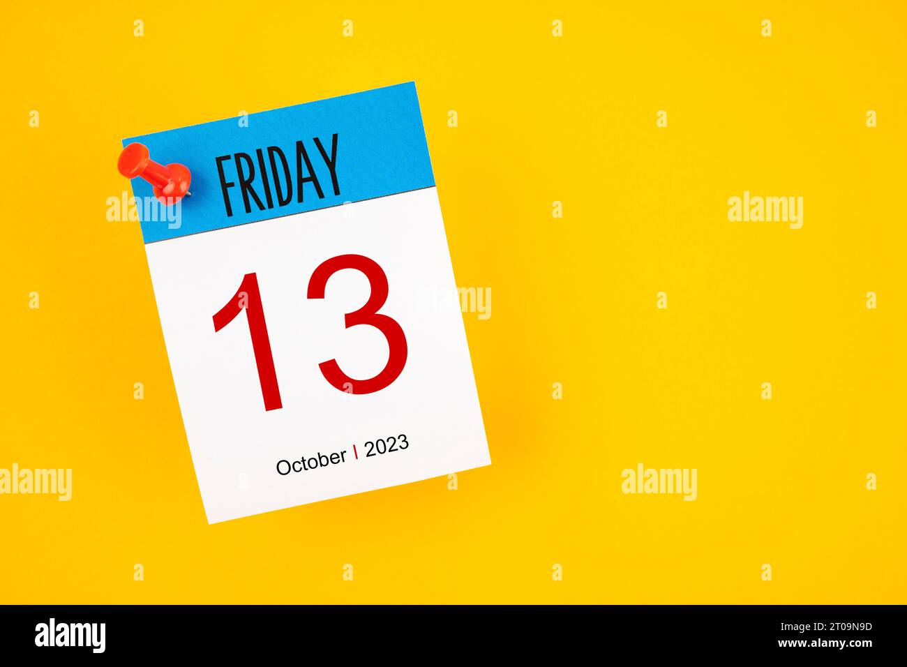 Calendar Friday the 13th October 2023 and push pin on yellow background ...