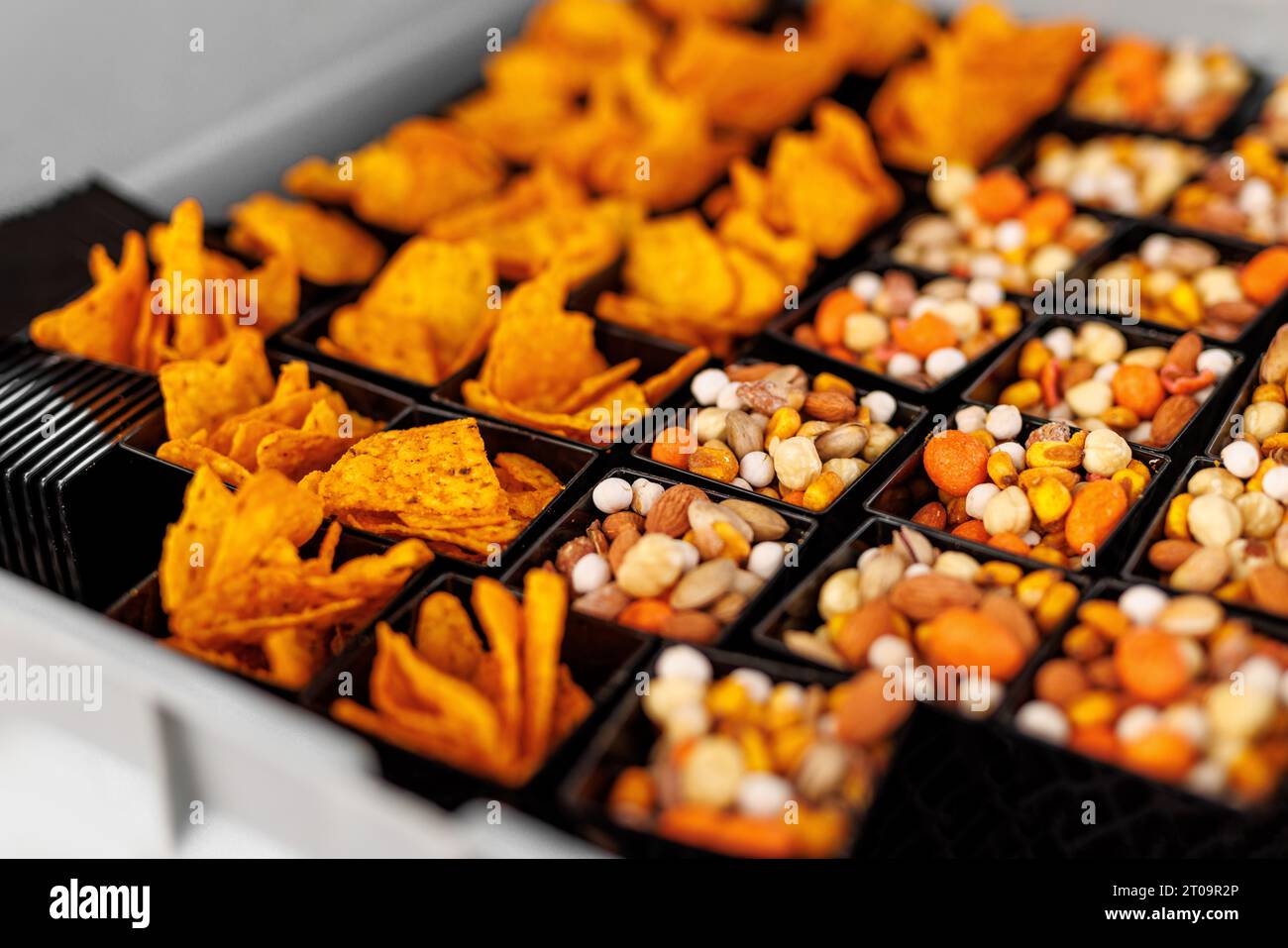 Nuts and chips in a set of beer snacks Stock Photo - Alamy
