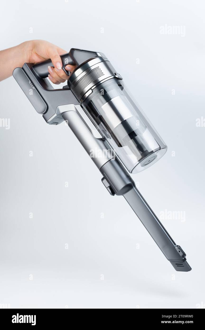 Small vacuum cleaner with narrow nozzle side view isolated on white ...