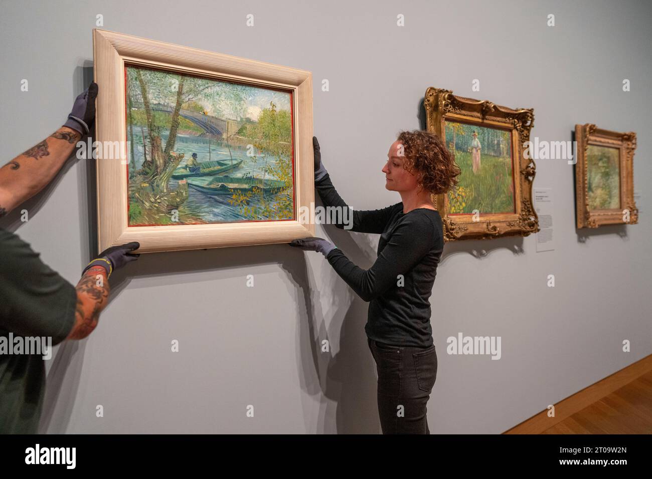 Employees pose with Fishing in Spring, the Pont de Clichy, 1887, the ...