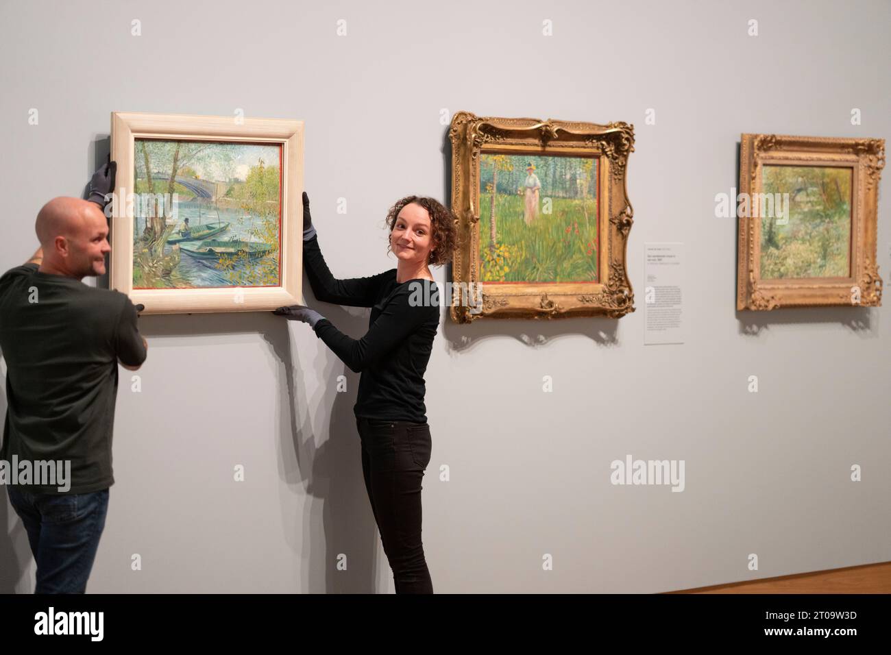 Employees pose with Fishing in Spring, the Pont de Clichy, 1887, the ...