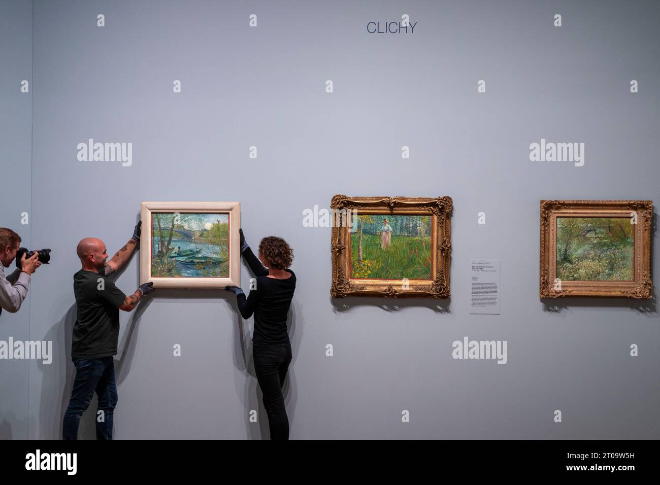 Employees pose with Fishing in Spring, the Pont de Clichy, 1887, the ...