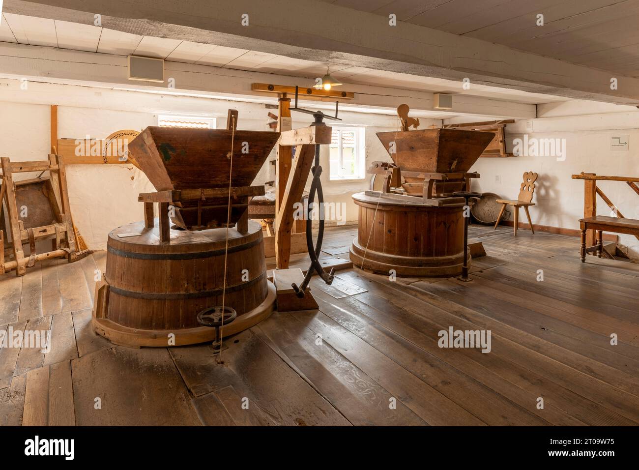 Grinding room of a historic water mill with two grinding funnels ...