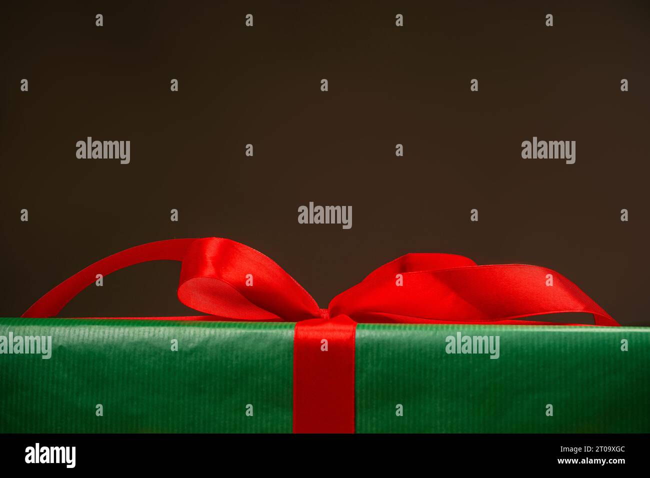 Gift paper wrapped boxes. Present boxes with rope bow. Prepare gifts ...