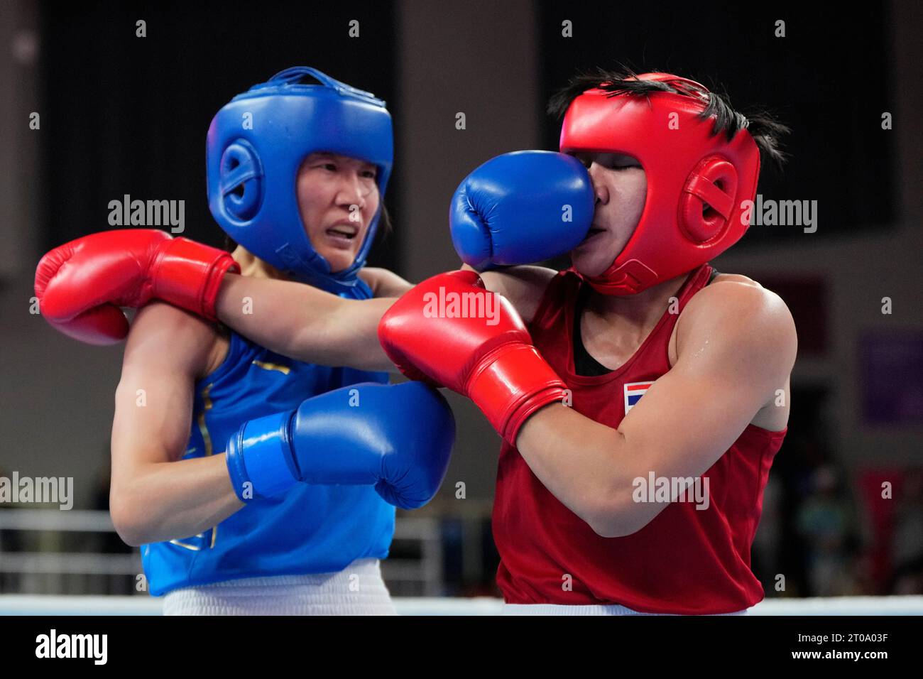 China's Yang Liu, left, competes with Thailand's Janjaem Suwannapheng ...