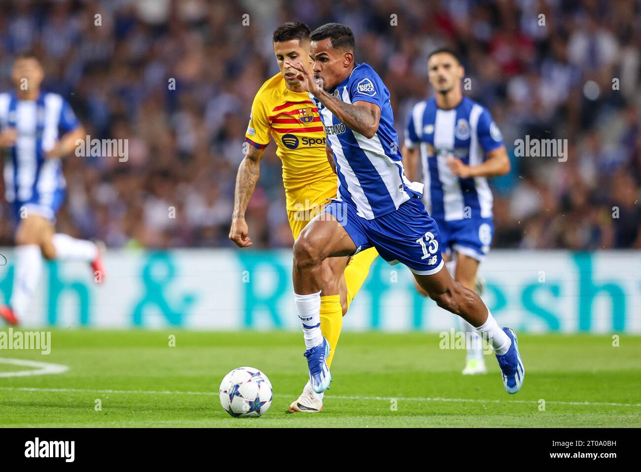 Galeno (FC Porto) and João Cancelo (FC Barcelona) in action during the ...