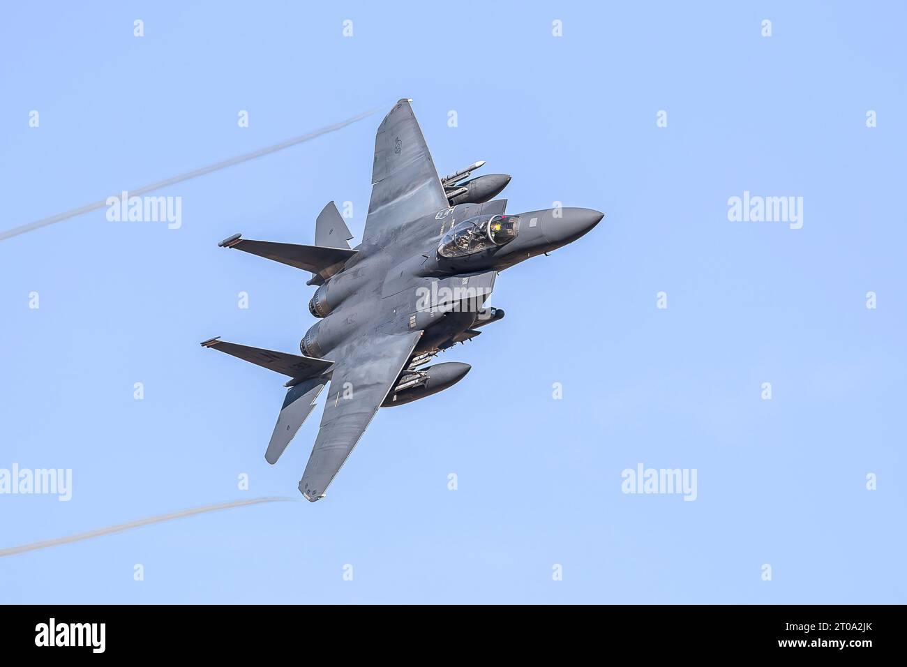 Military f15 jet aircraft flies through the sky Stock Photo - Alamy