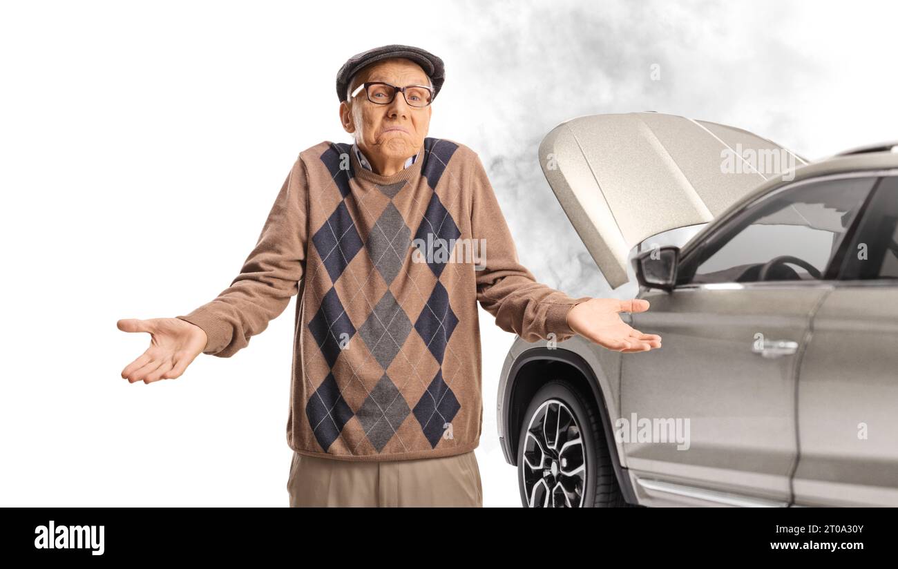 Confused elderly man standing in front of a broken car isolated on ...