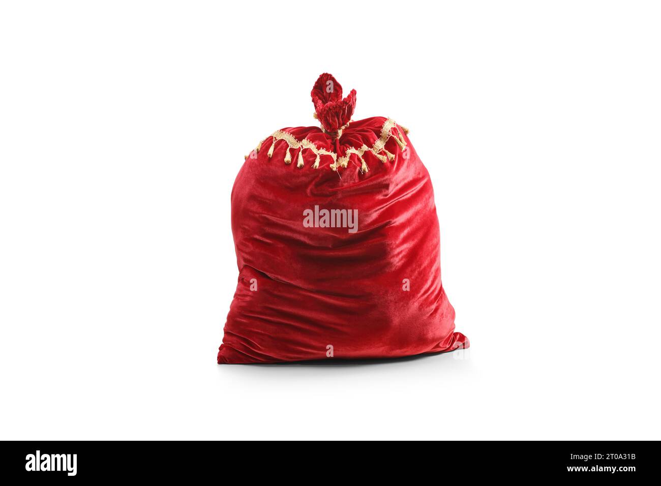 Studio shot of a red velvet sack full of presents isolated on white ...