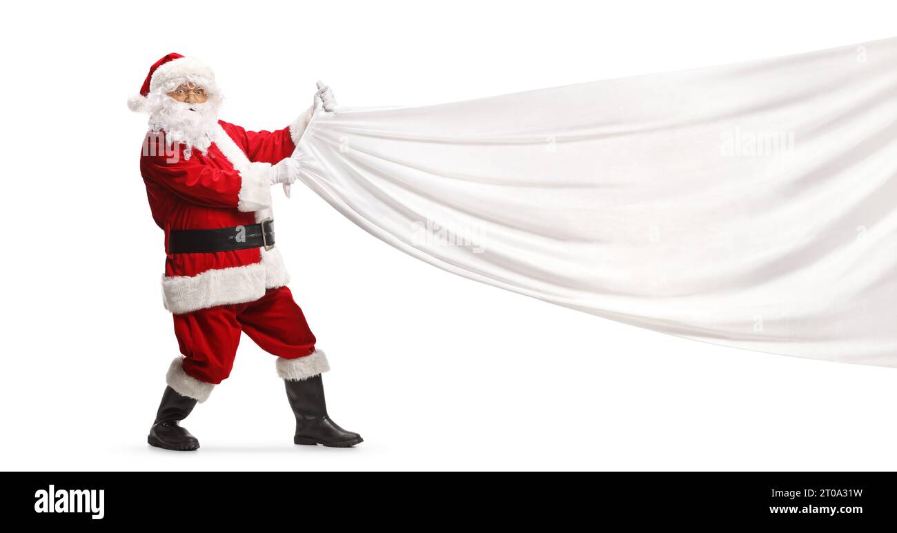 Santa Claus pulling a white piece of cloth isolated on white background ...