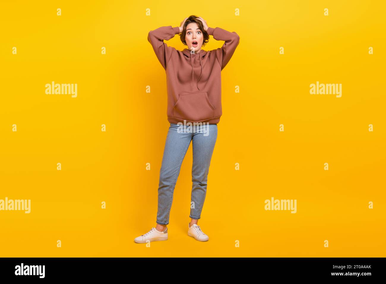 Full photo of young confused lady staring hands head denim jeans brown ...