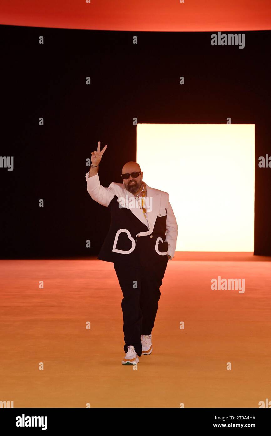 Designer Charaf Tajer walks on the runway at the Casablanca fashion ...