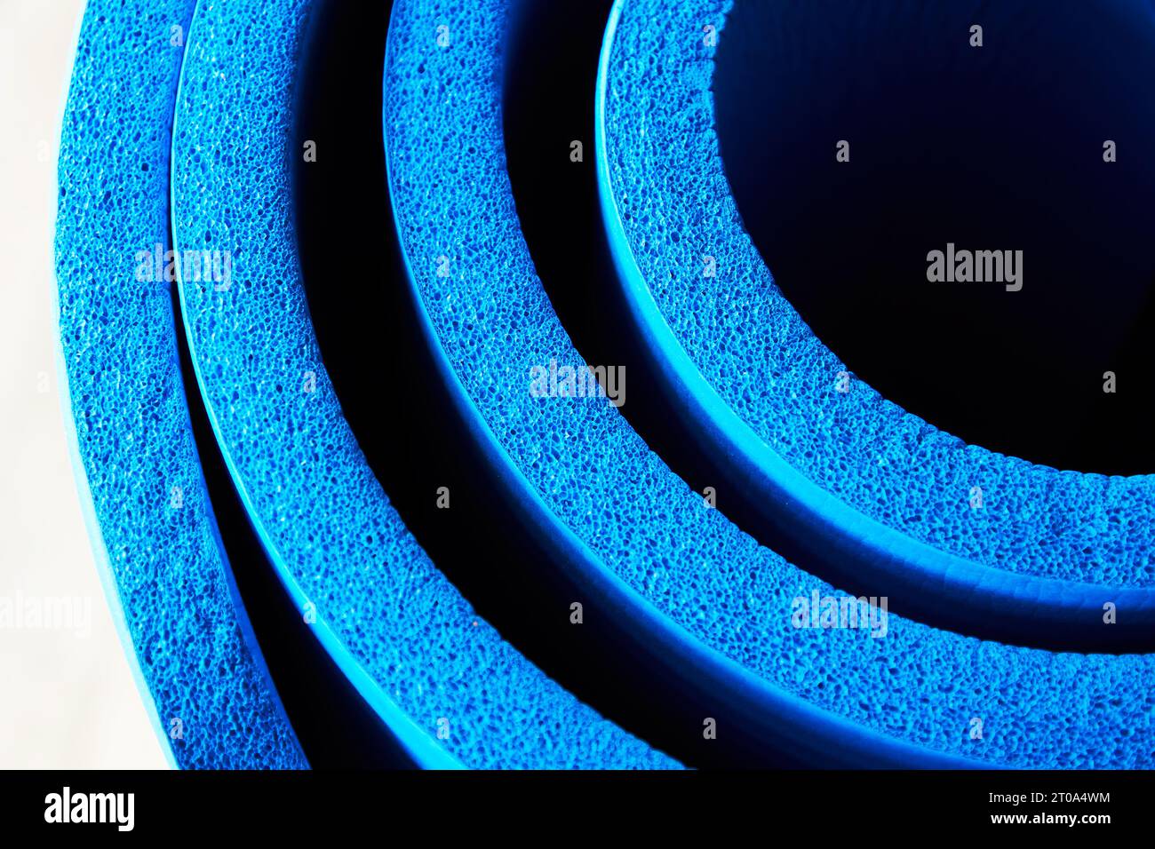 Side close up view of soft foam blue fitness rolled mat. Sports and ...