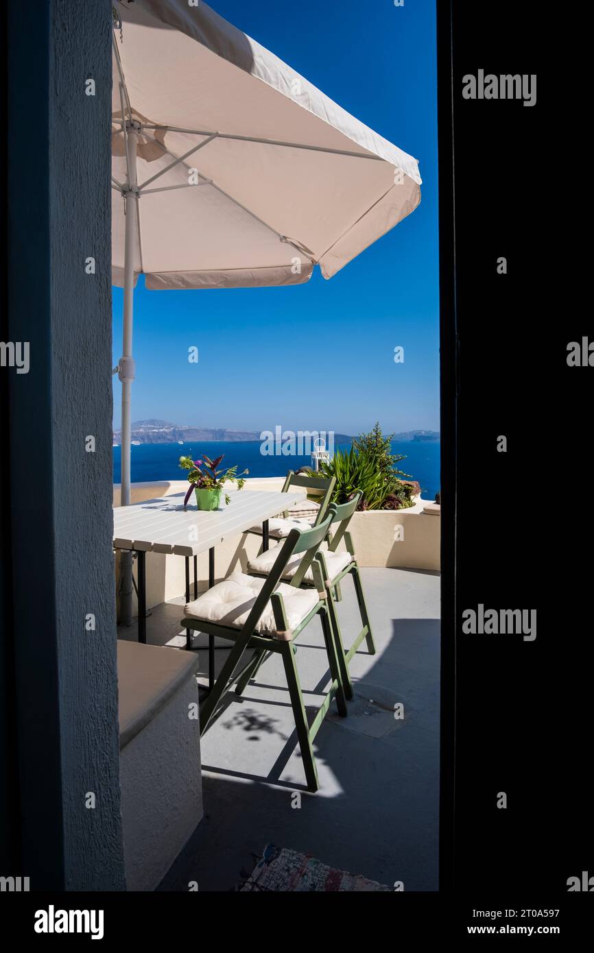 Terrace balcony with parasol umbrella and beautiful coastal views in ...