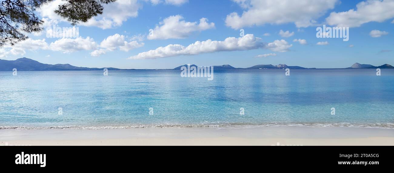A picturesque view of Formentor Beach showcases its clear, transparent ...