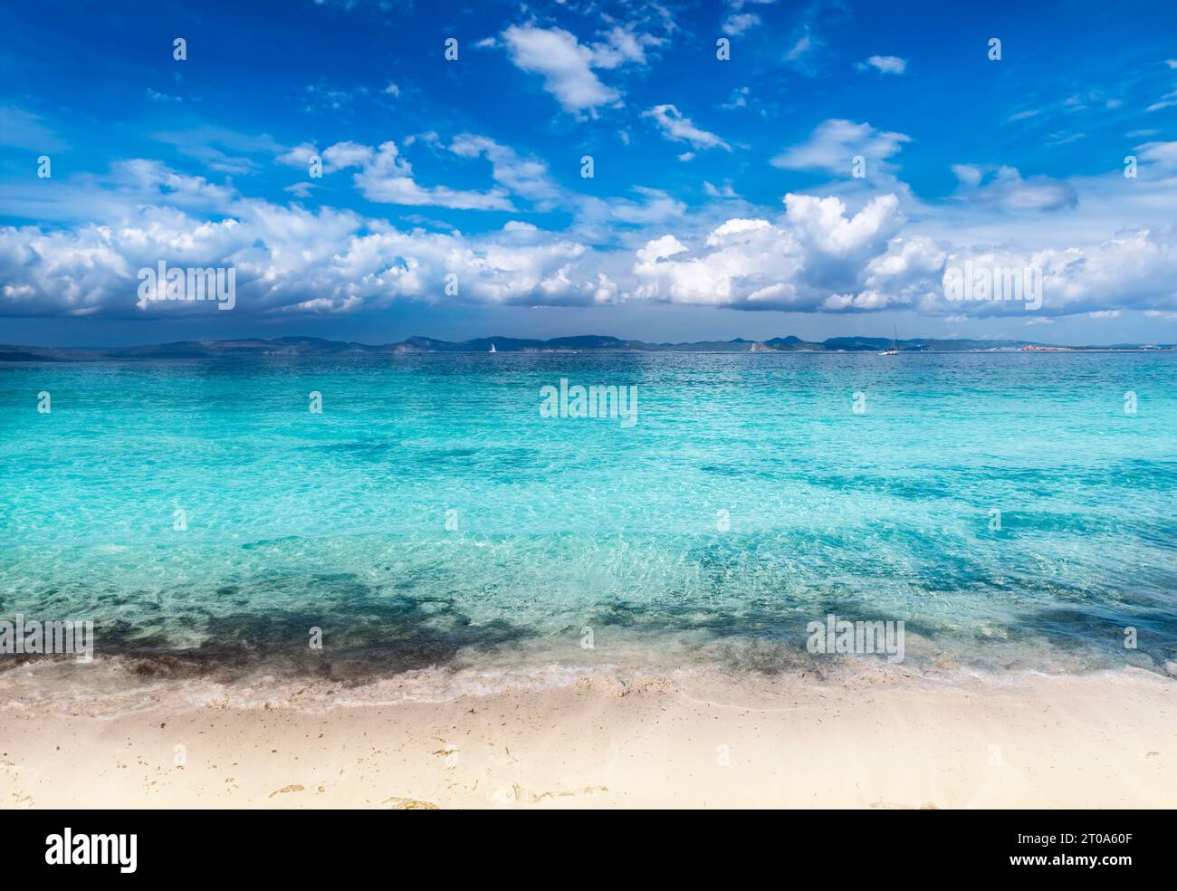 A sun-kissed shoreline stretches out on Formentera, capturing the ...