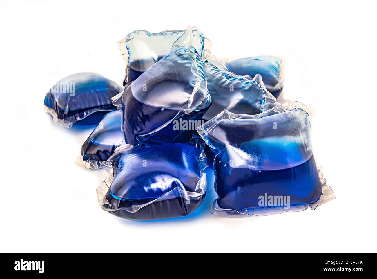 square capsules with blue washing gel on a white background. High ...