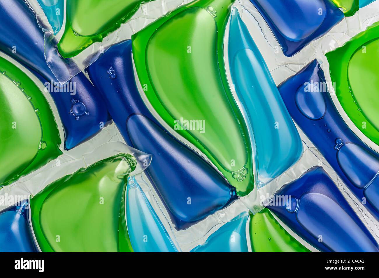 square capsules with colored gel for washing on a white background ...