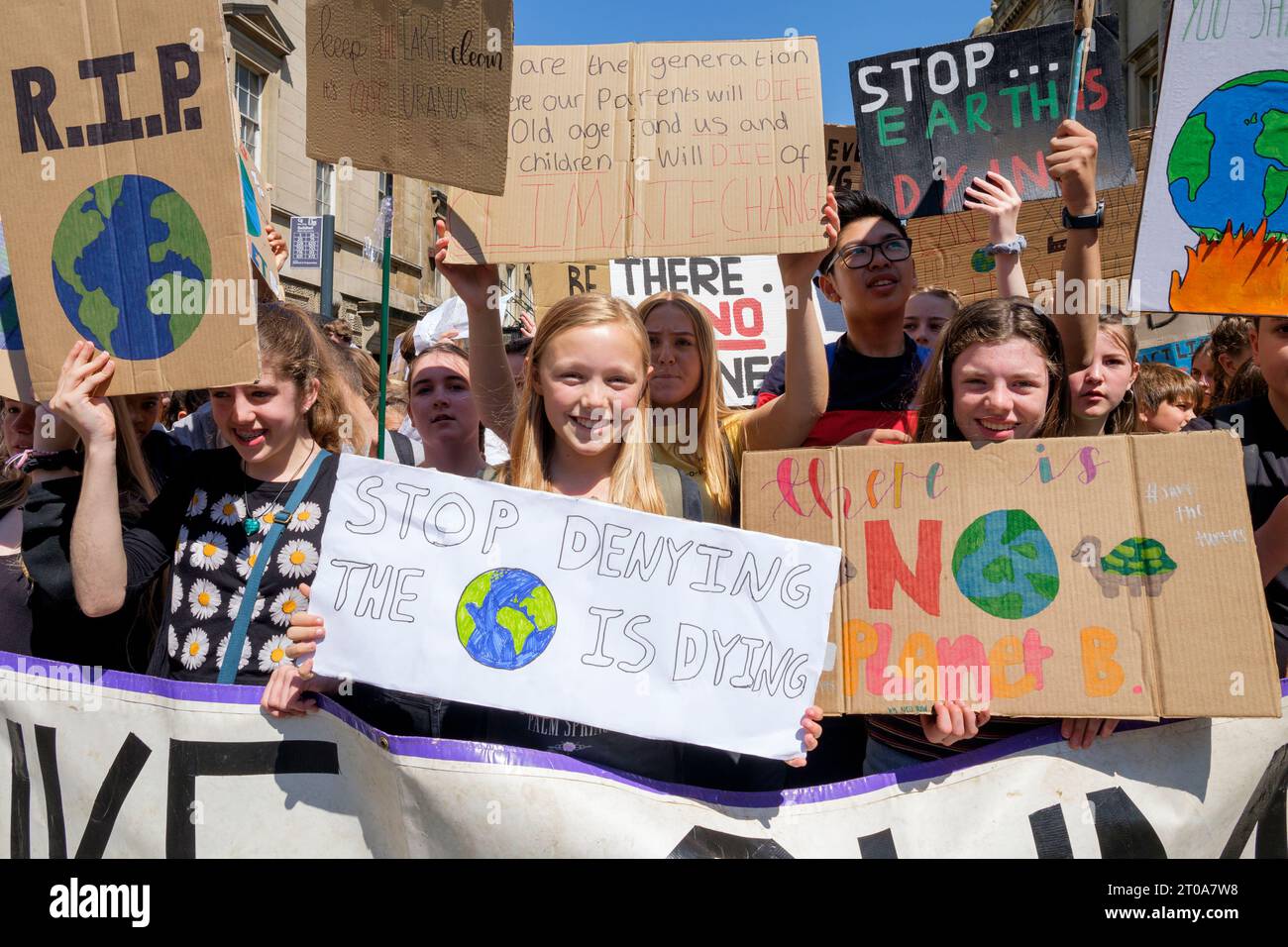 Bath college students and school kids carrying climate change placards ...
