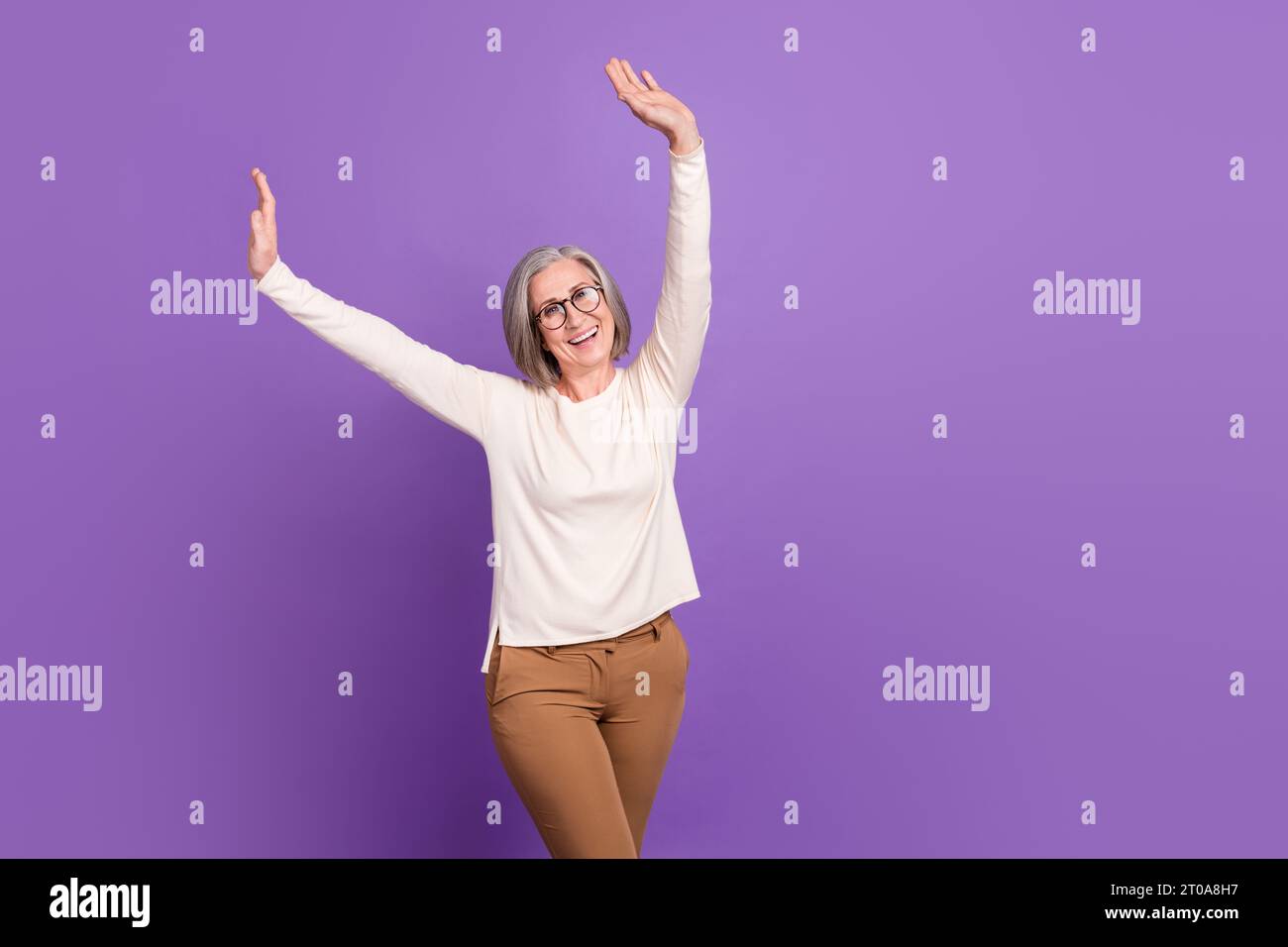 Photo of funny senior lady raise arms dancing aged community gathering ...