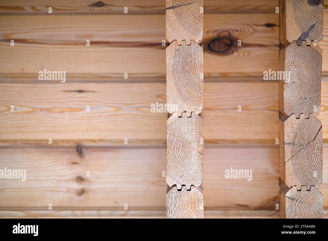 Natural background pattern of log wall. Construction of houses made of ...
