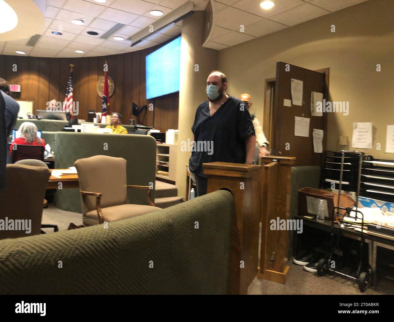 Joel Bowman (masked) enters a courtroom on Thursday, Oct. 5, 2023 in ...