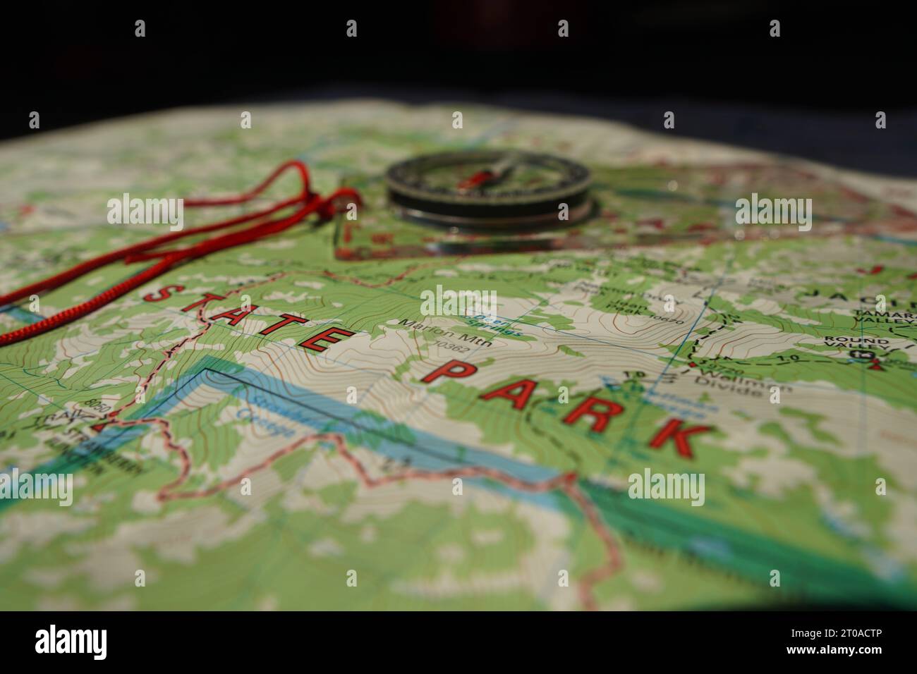 Closeup map and compass with State Park text prominently featured ...