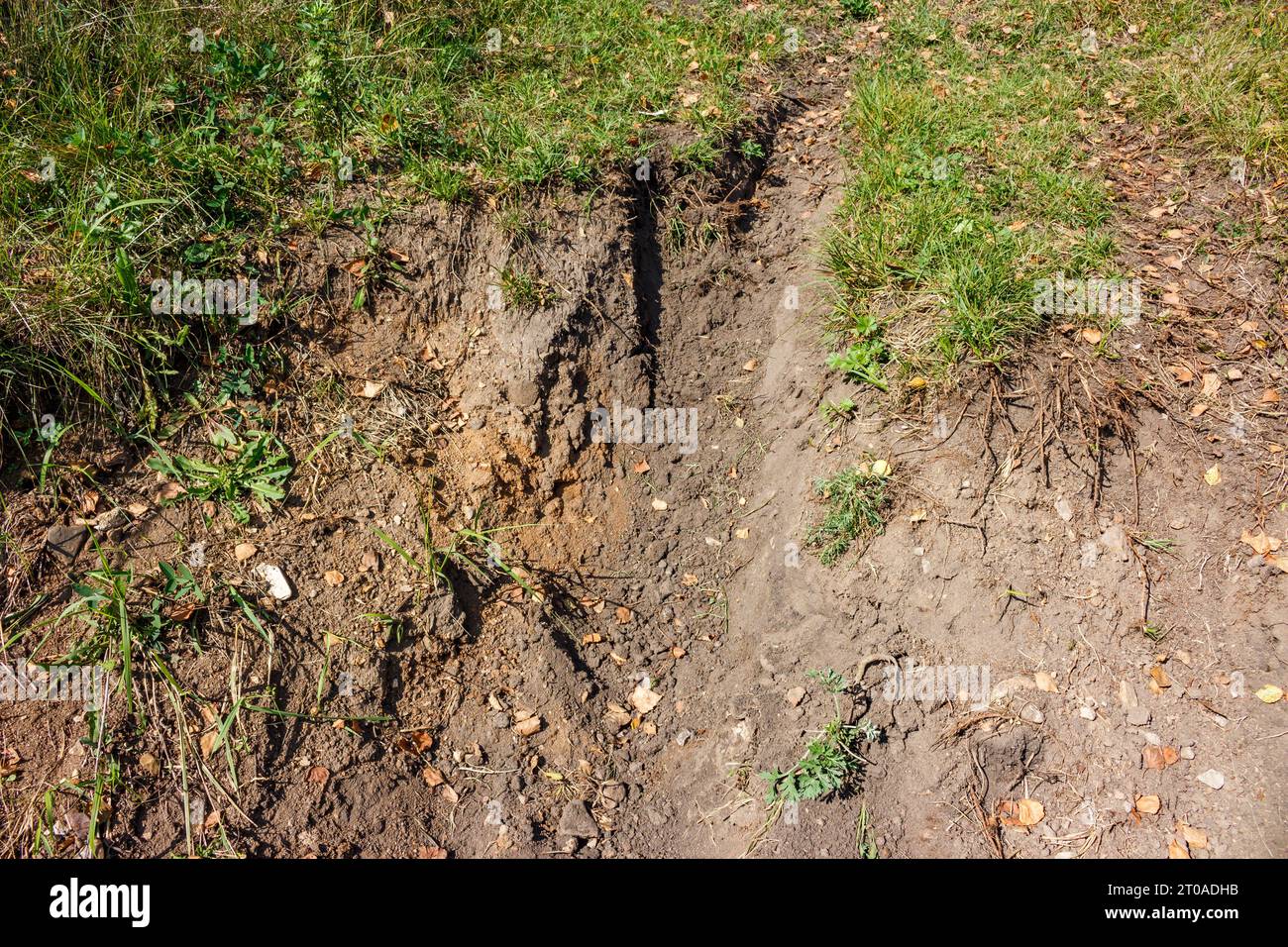Unovergrown and open layer of gray earth in a field Stock Photo - Alamy