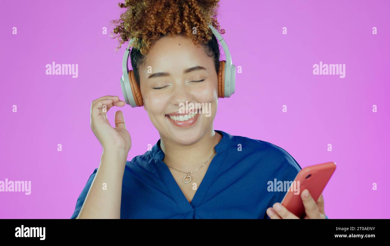 Headphones, music and woman with phone in studio listening to song ...