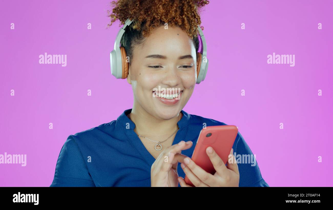 Headphones, happy and woman with phone in studio listening to song ...