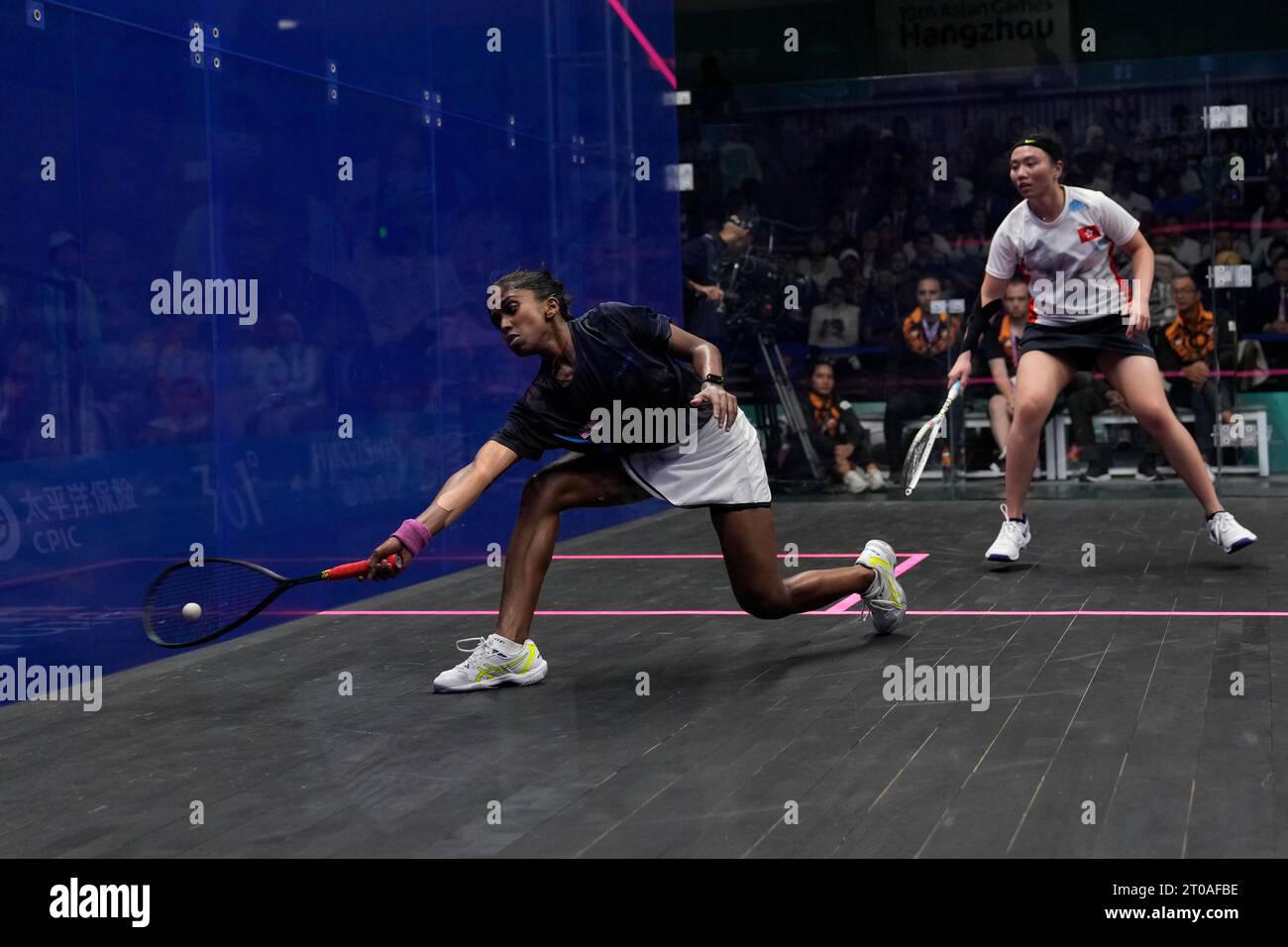 Malaysia's Subramaniam Sivangasari, left, competes against Hong Kong's ...