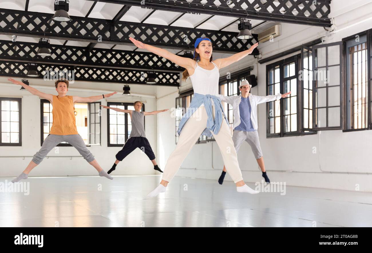 Teenage dancers jumping together during workout Stock Photo - Alamy