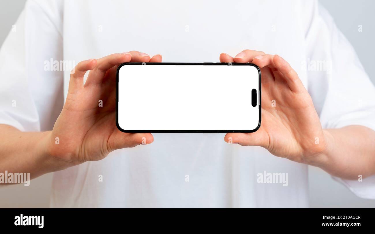 Berlin, Germany September 16 2023 Hand holding horizontal mobile phone ...