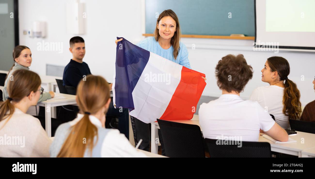 Geography lesson in school class - teacher talks about France, holding ...