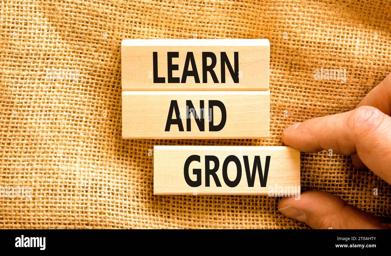 Learn and grow symbol. Concept word Learn And Grow on beautiful wooden ...