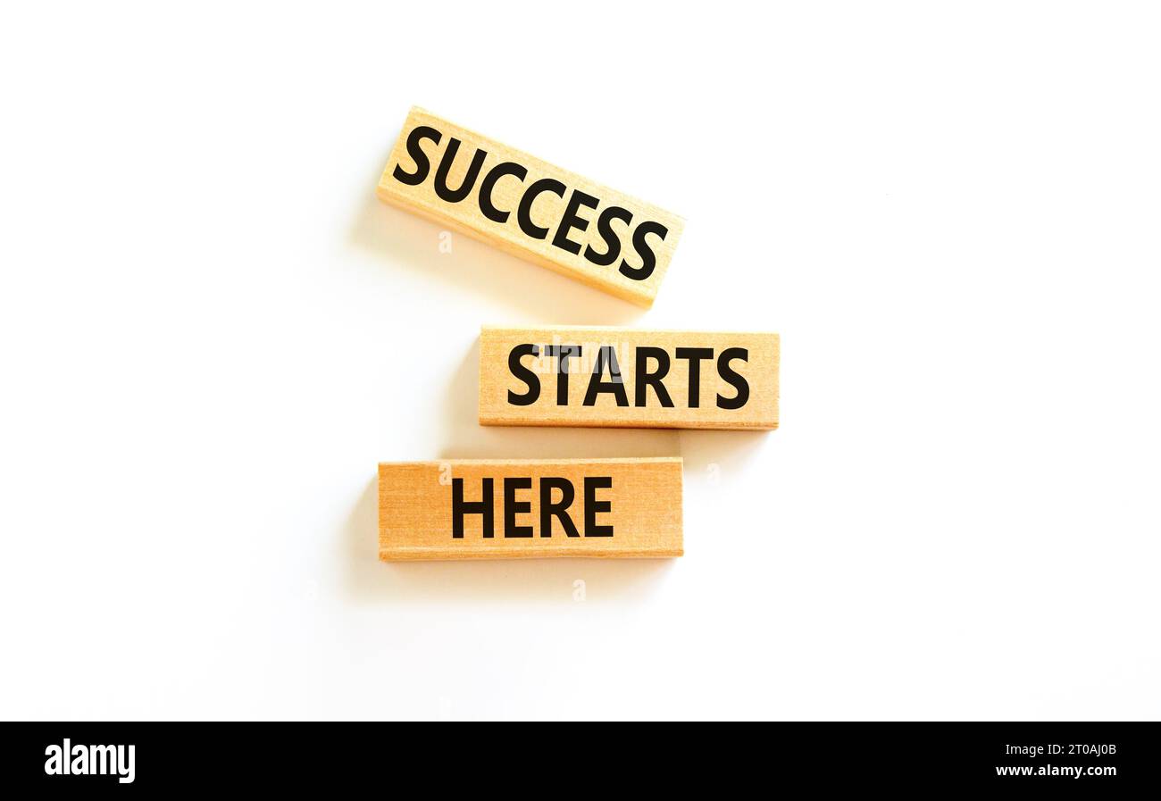 Success starts here symbol. Concept word Success starts here on beautiful wooden block ...