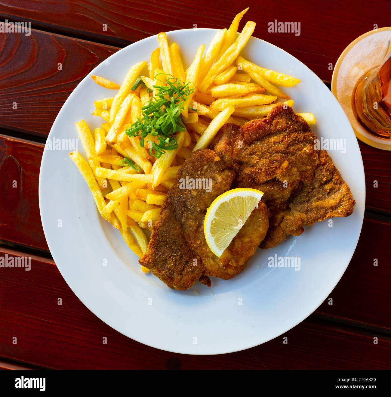 Cooked fried pork meat chops with fried potato Stock Photo - Alamy
