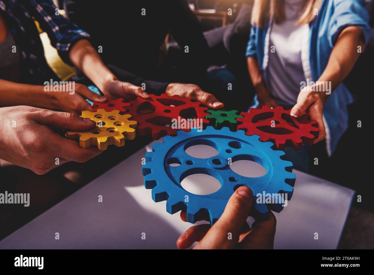 Business team work together and combine pieces of gears. Partnership ...