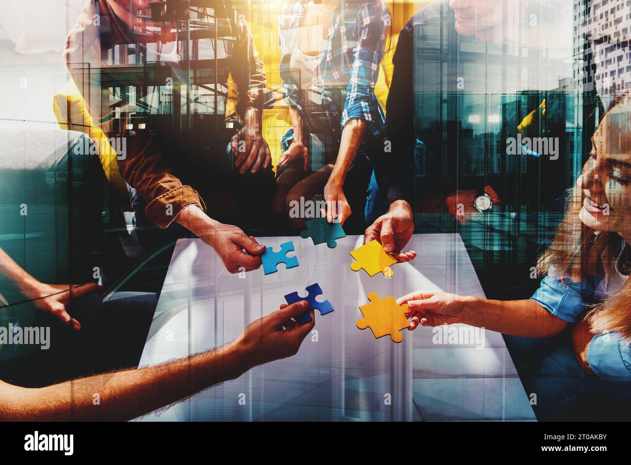 Businessmen working together to build a puzzle as teamwork, partnership ...