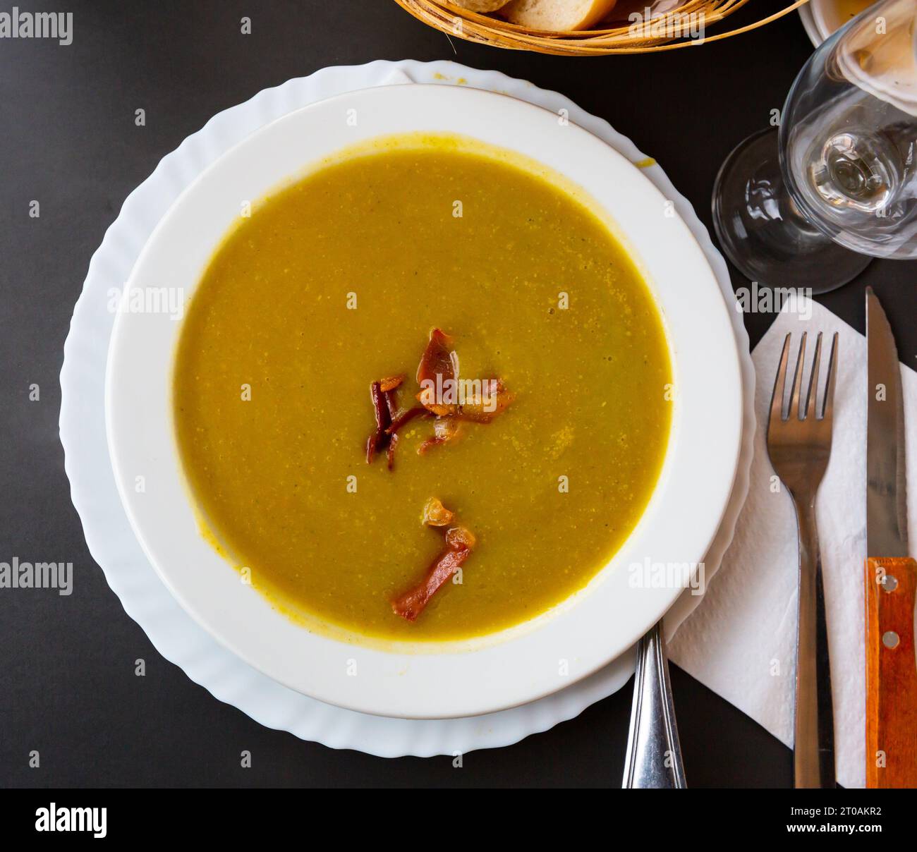 Hearty vegetable soup puree with ham pieces Stock Photo - Alamy