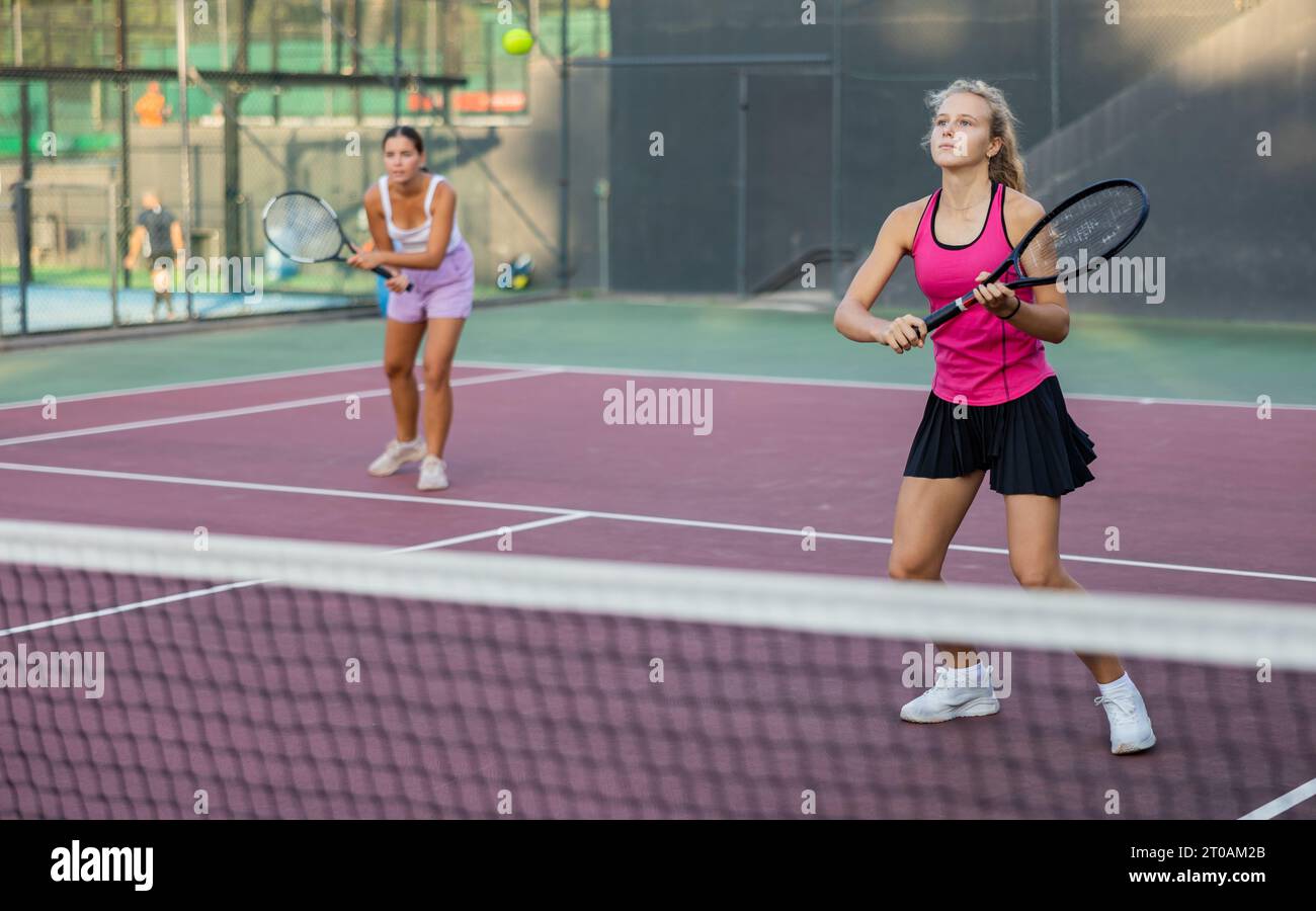 Portrait of emotional woman tennis player during friendly doubles ...