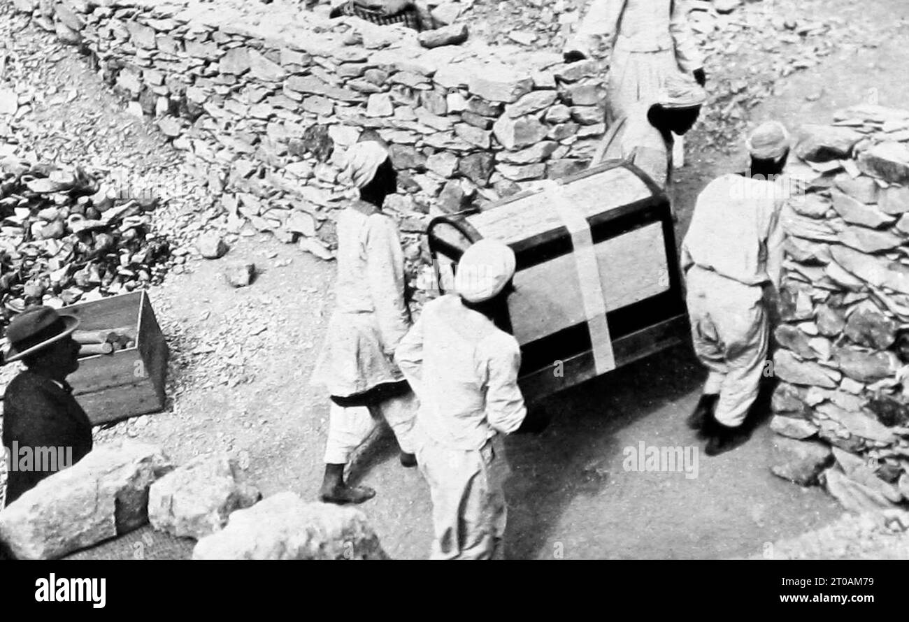 Howard Carter supervising artifacts being removed from the tomb of ...