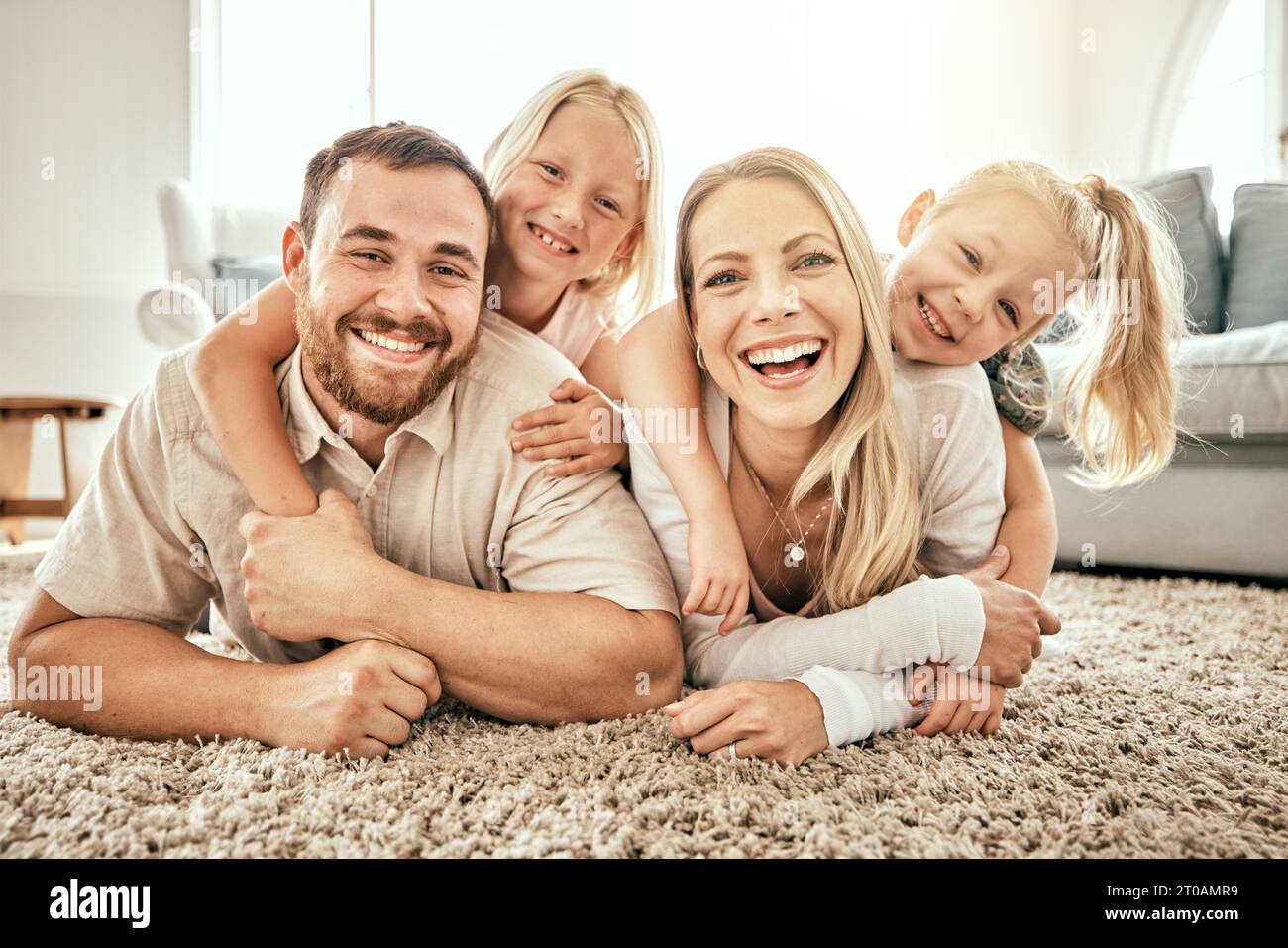 Happy, smile and portrait of family in the living room bonding, hugging ...