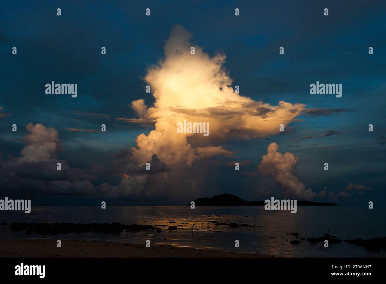 Beautiful bright cloud above the ocean at dusk. Early morning landscape ...